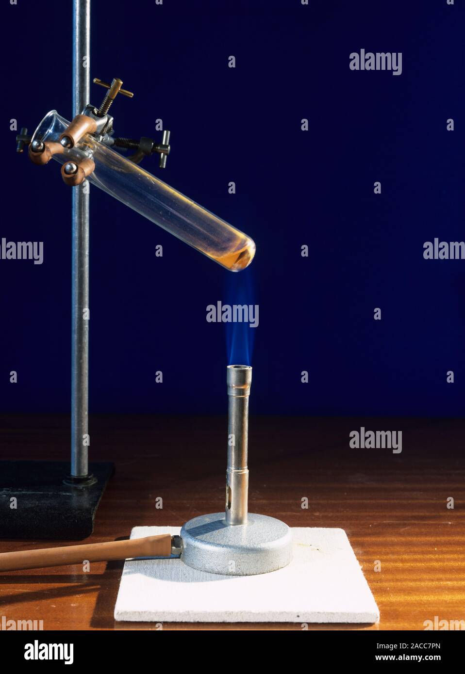 Thermolysis of mercury oxide. Mercury oxide (HgO) being heated in a ...