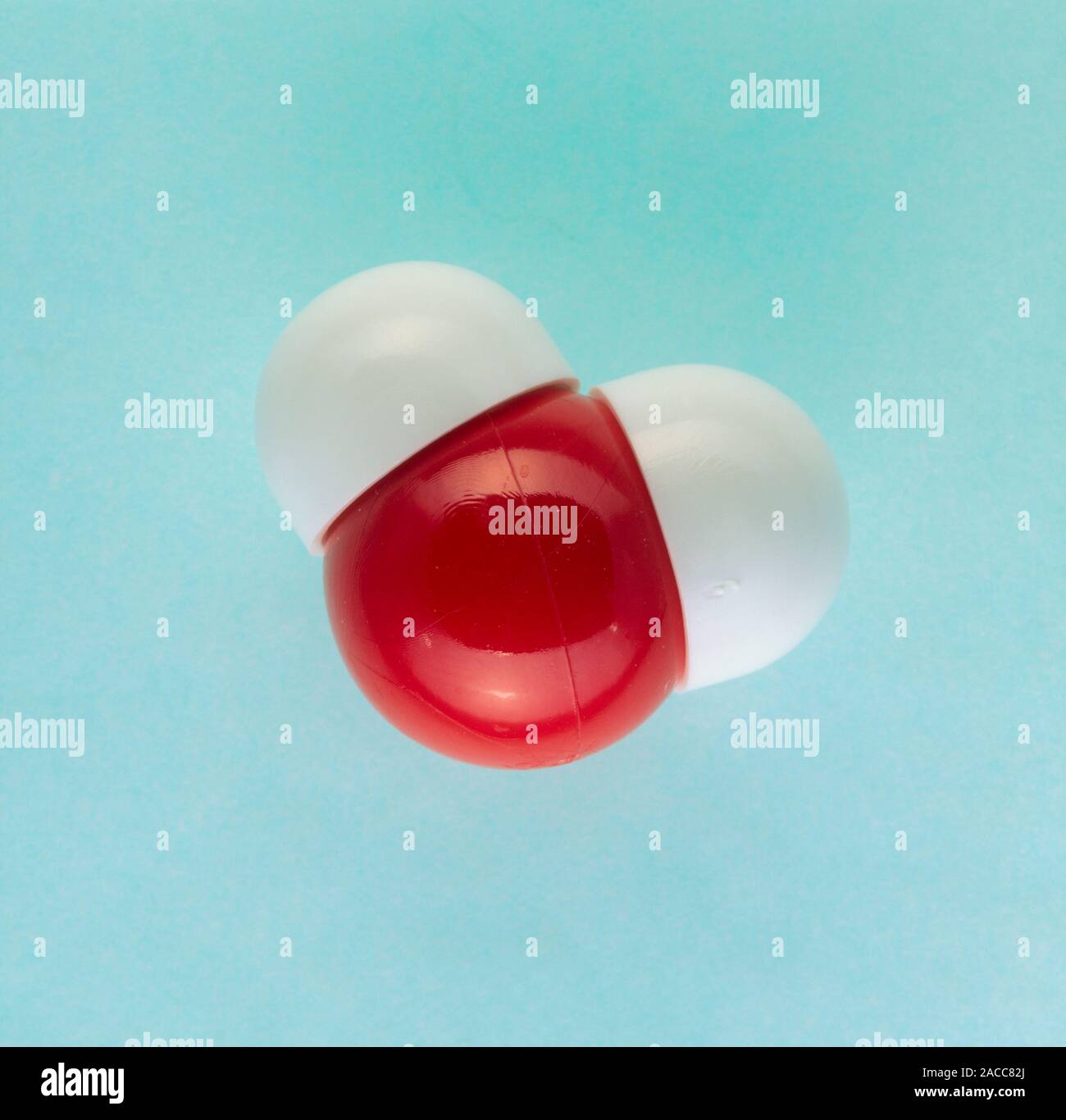 Water. Molecular model of water. The red sphere represents an oxygen ...