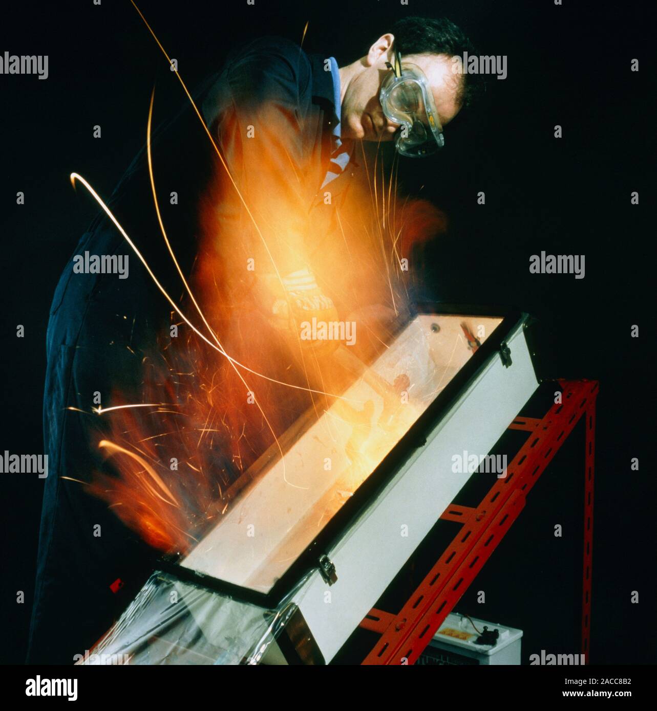 Thermite reaction. Time-exposure image of sparks caused by a thermite ...