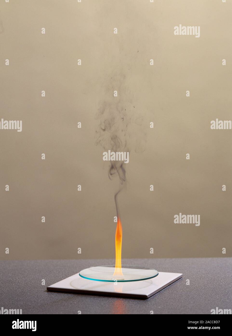 Combustion of a cycloalkene in a watchglass. Cyclohexene (or ...