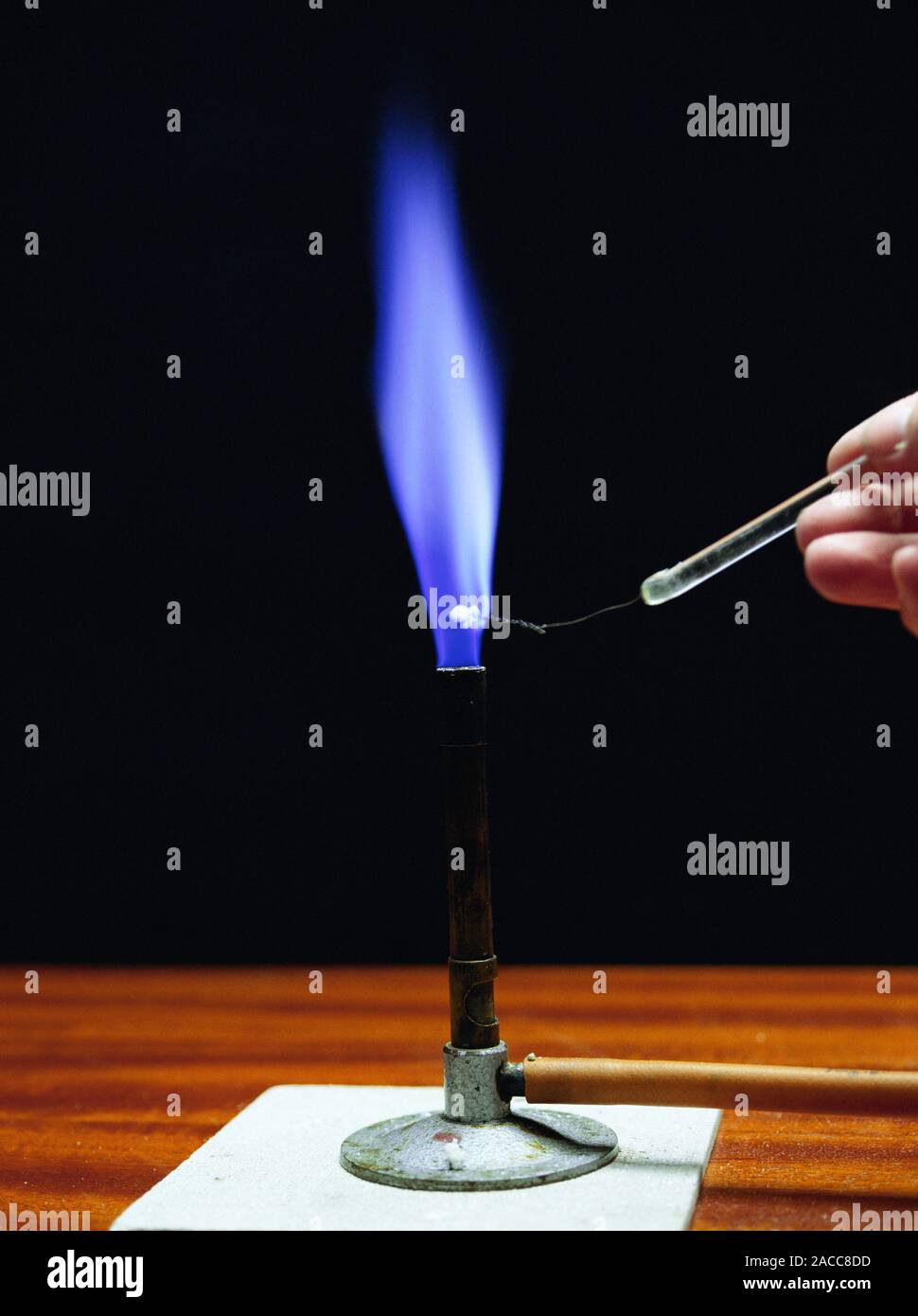 Flame test on potassium. Potassium compounds give a distinctive lilac ...