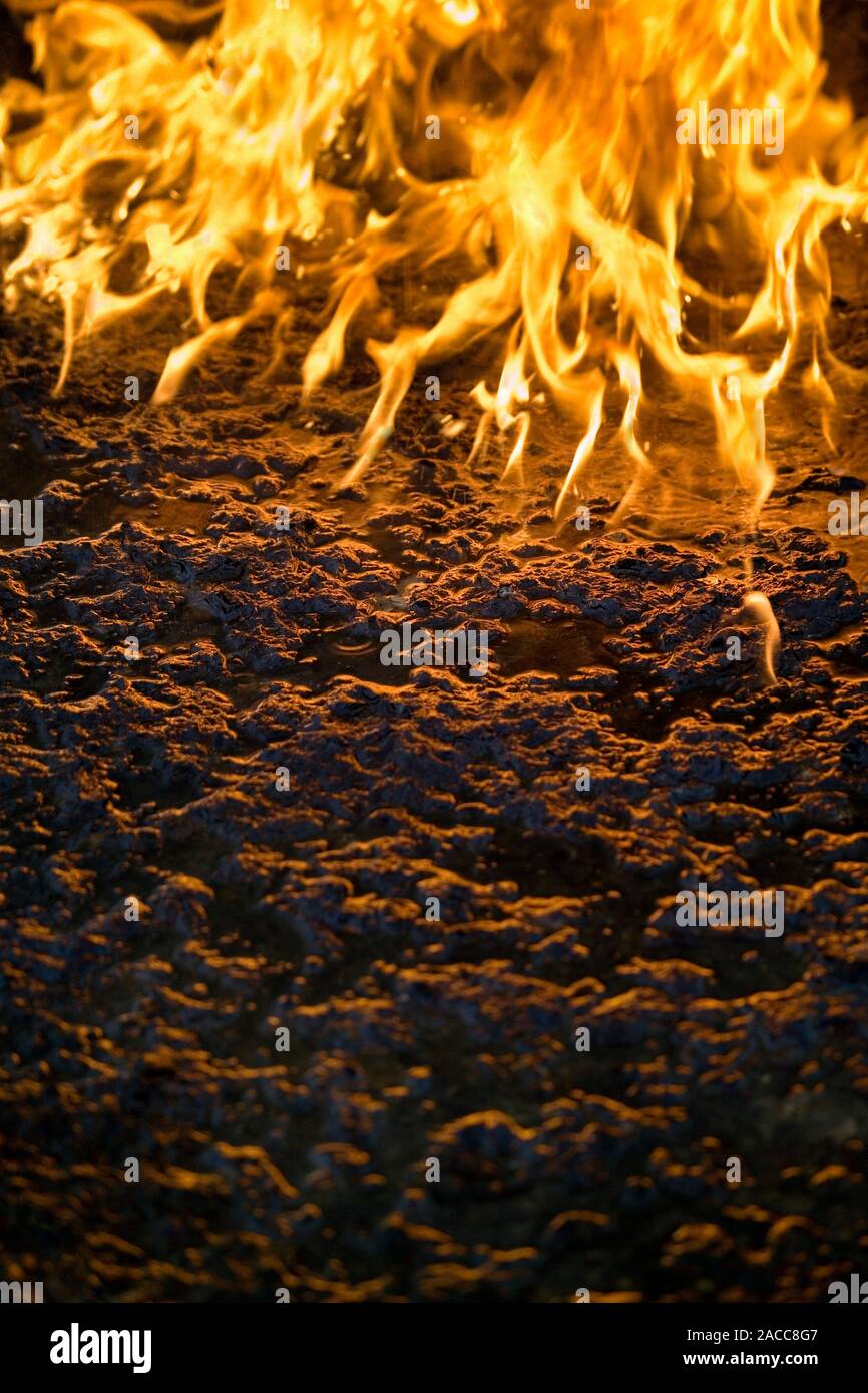 Fire. Flammable liquid burning on the ground Stock Photo - Alamy