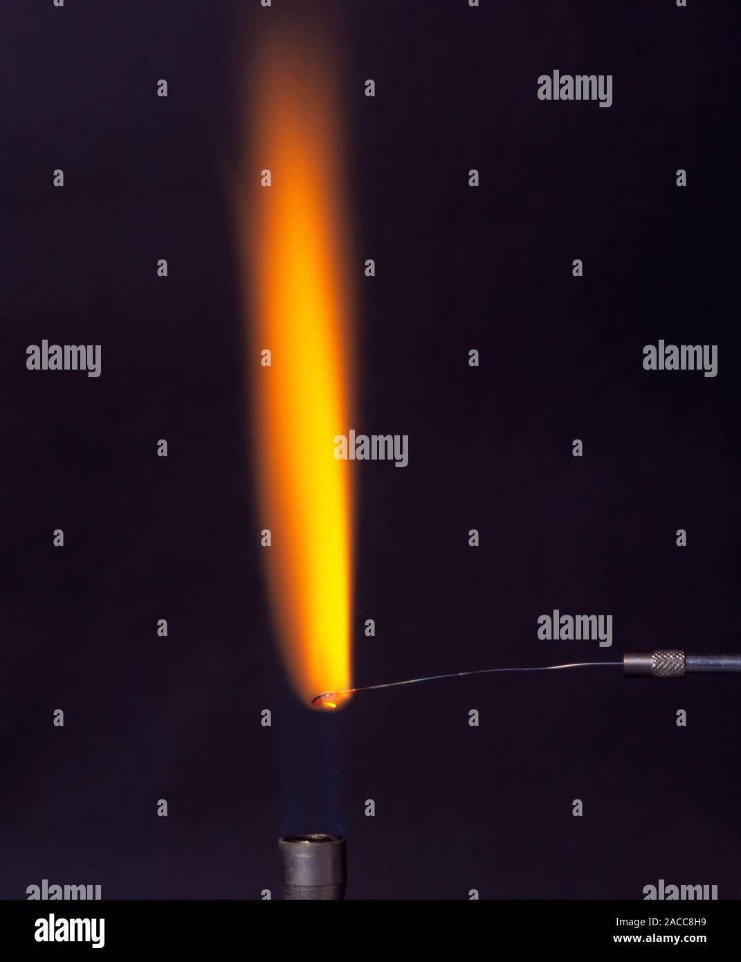 Flame test for sodium. A compound containing the element sodium (symbol ...