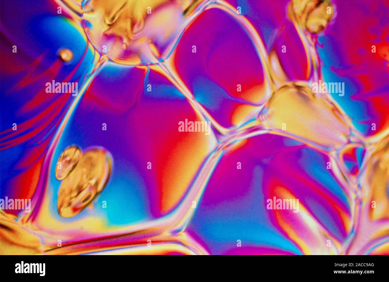 Liquid crystal. Polarised light micrograph of liquid crystal. Although ...