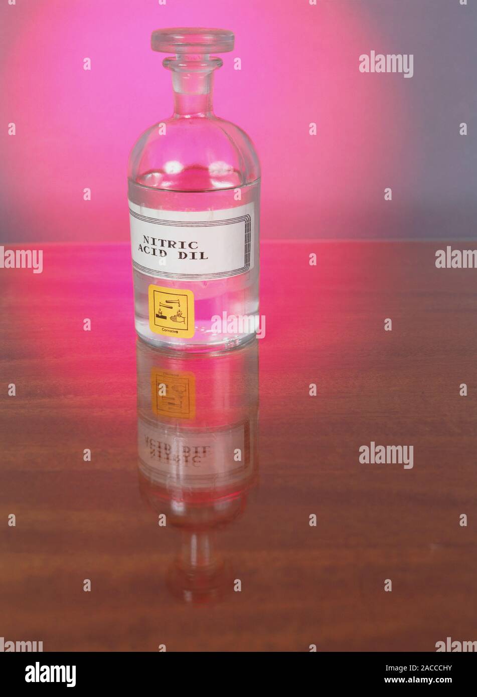 Nitric acid. Reagent bottle of dilute nitric acid (HNO3). This is a ...