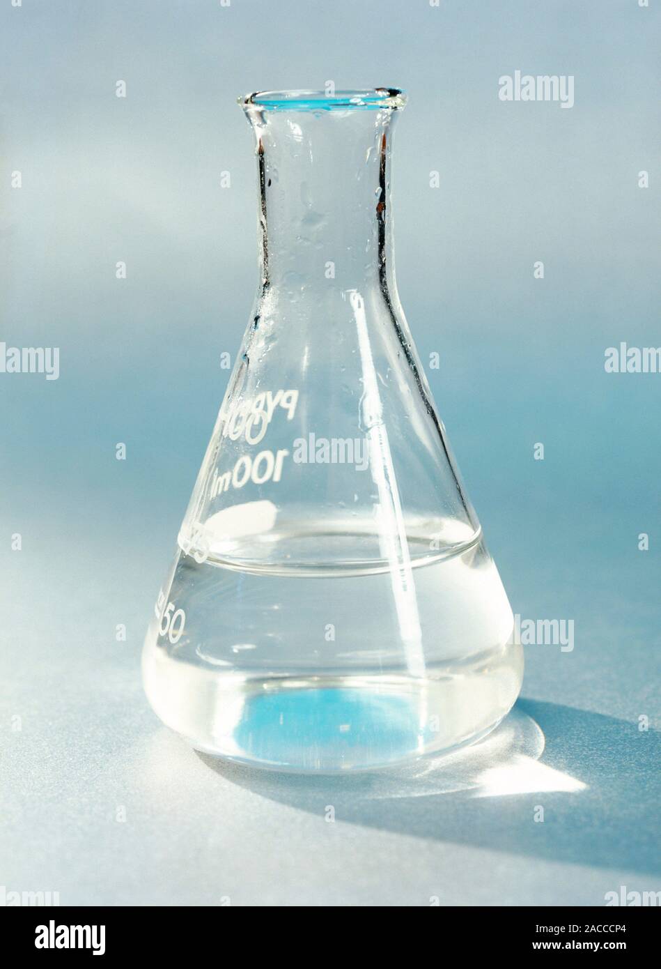 Manganese solution. Flask containing a solution of manganese (II) (Mn2 ...
