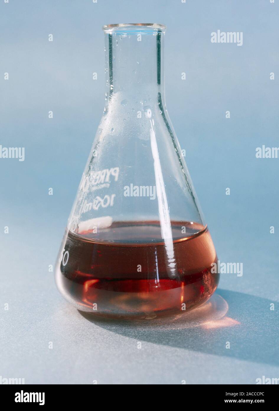 Manganese solution. Flask containing a solution of manganese (III) (Mn3 ...
