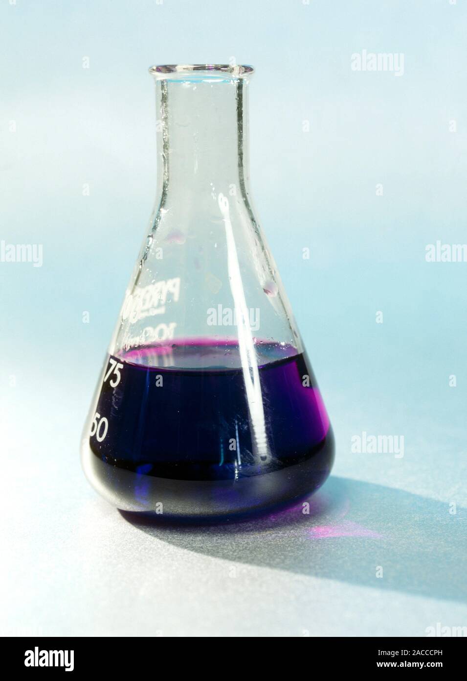 Manganese solution. Flask containing a solution of manganese (VII ...