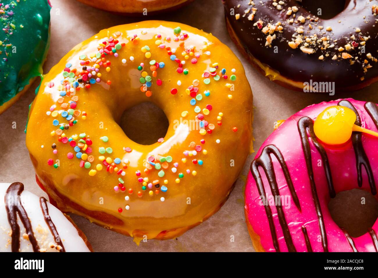 donuts in different tastes of different glazes Stock Photo - Alamy