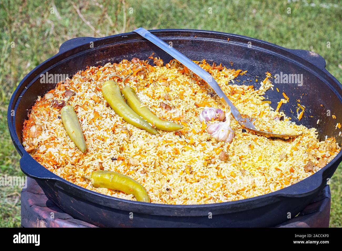 Traditional delicious pilaf with vegetables in a cauldron Stock Photo ...