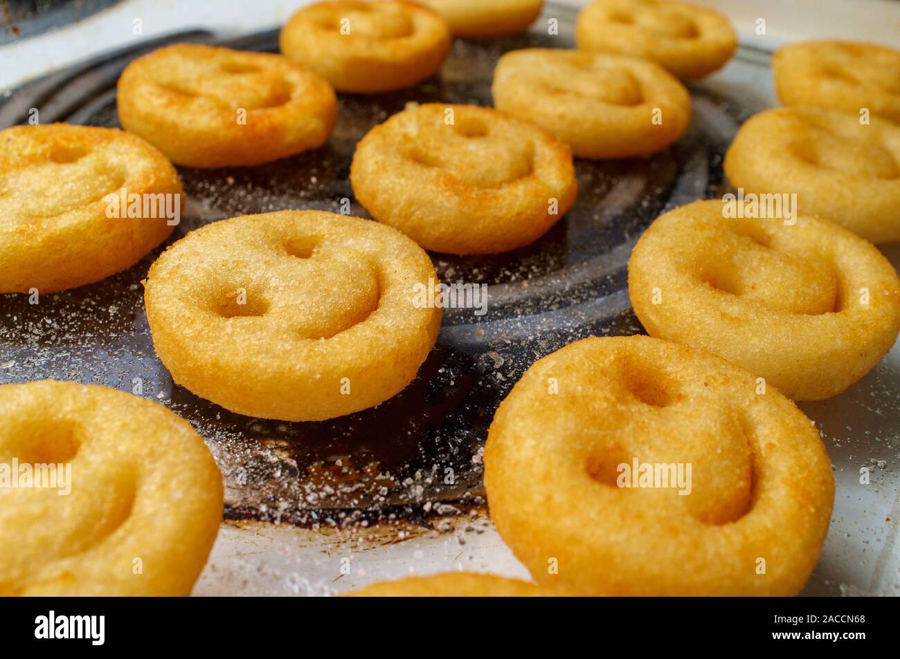 Happy French fried potato smiley faces in glass baking pan Stock Photo ...