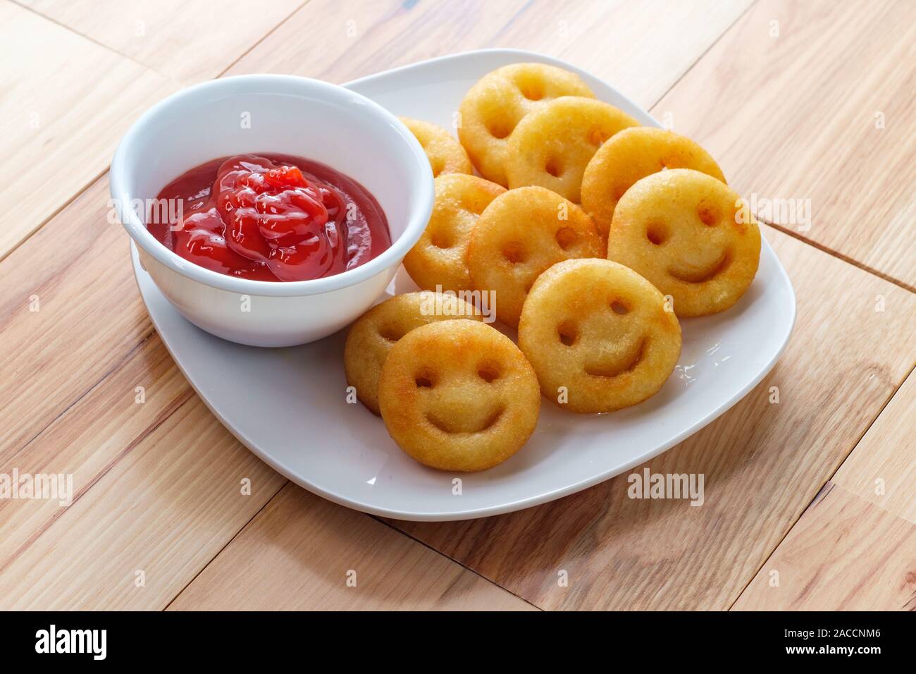 Happy French fried potato smiley faces with ketchup Stock Photo - Alamy