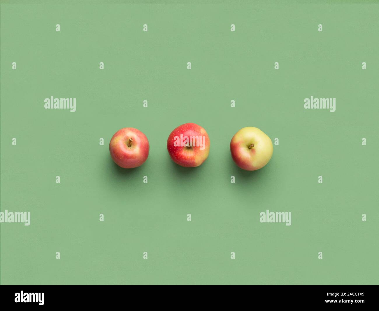 Fresh Apple minimalism on light green background Stock Photo - Alamy