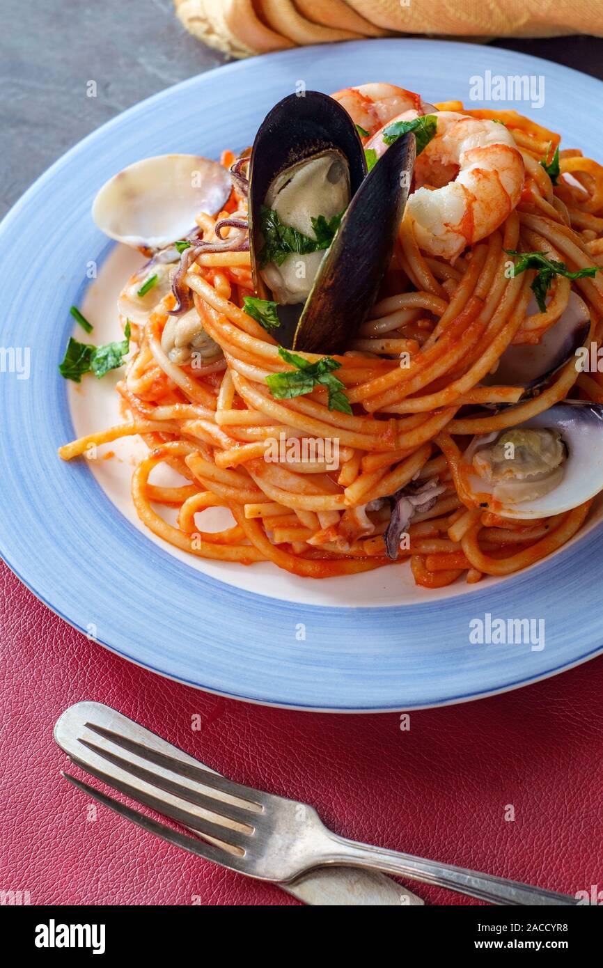 Italian seafood pasta pescatore with mussels clams shrimp and squid ...