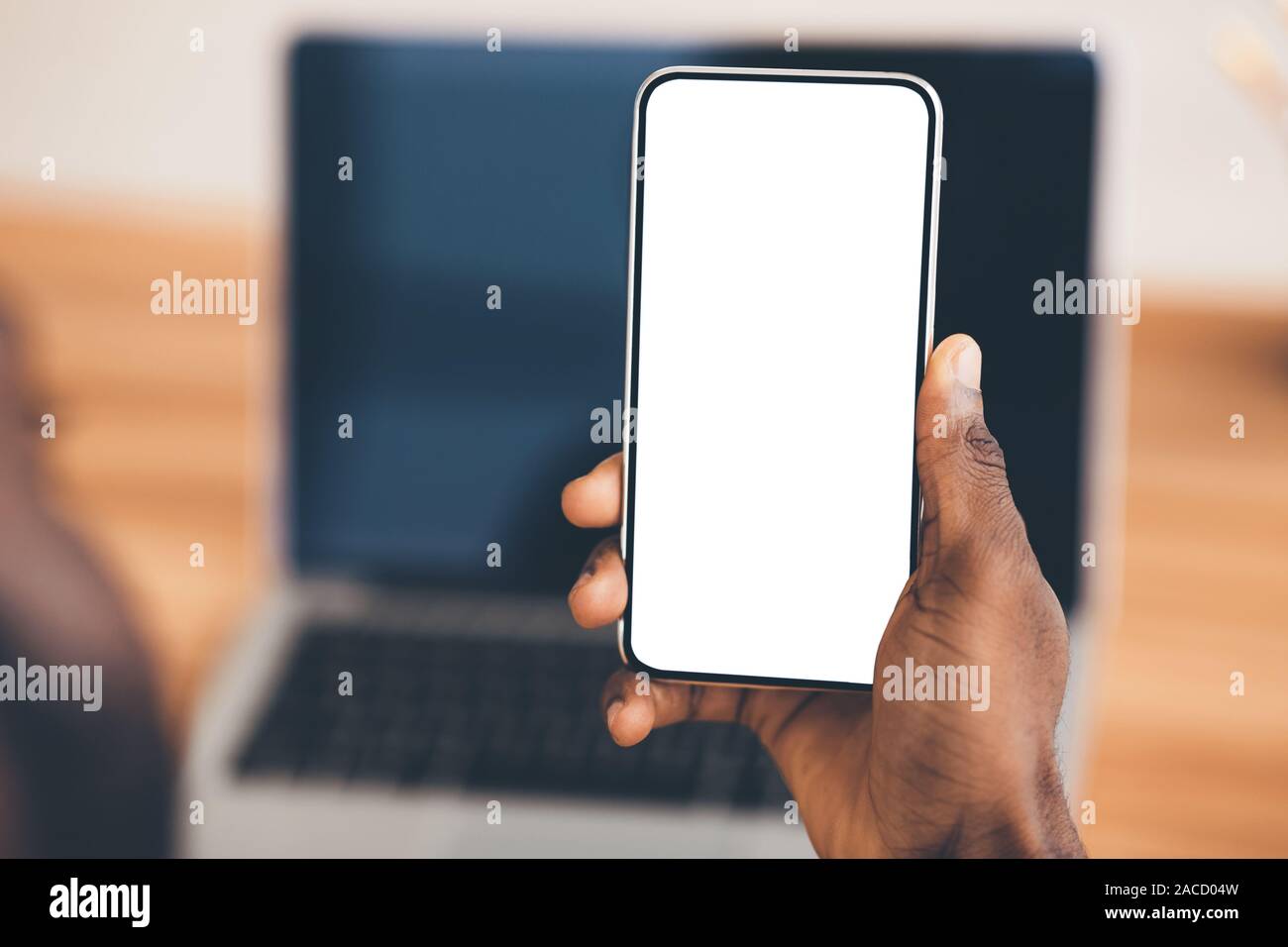 African american using black phone with blank screen Stock Photo - Alamy