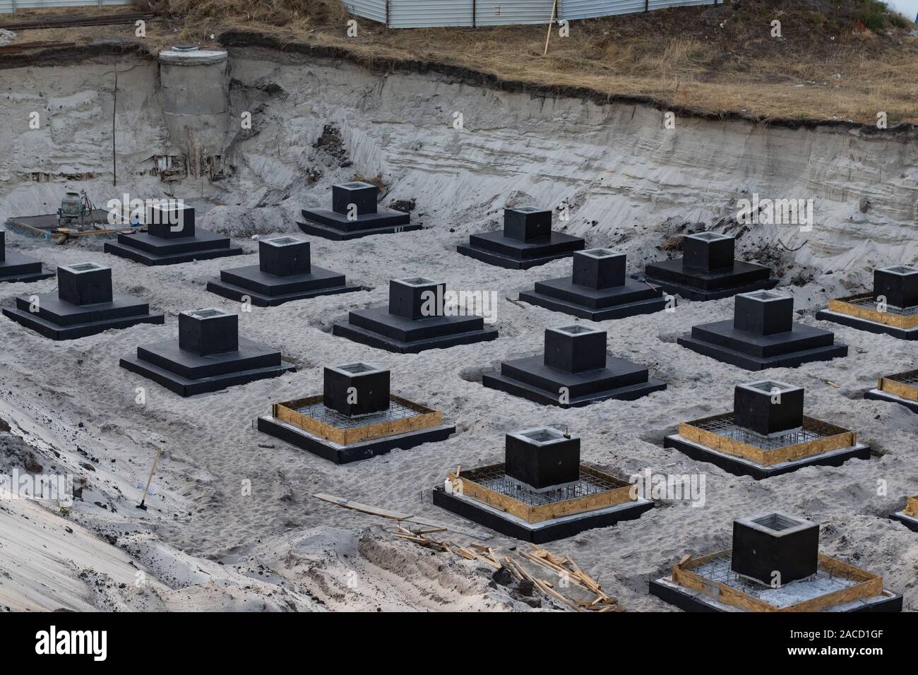 Concrete pile foundation for building on sands Stock Photo - Alamy