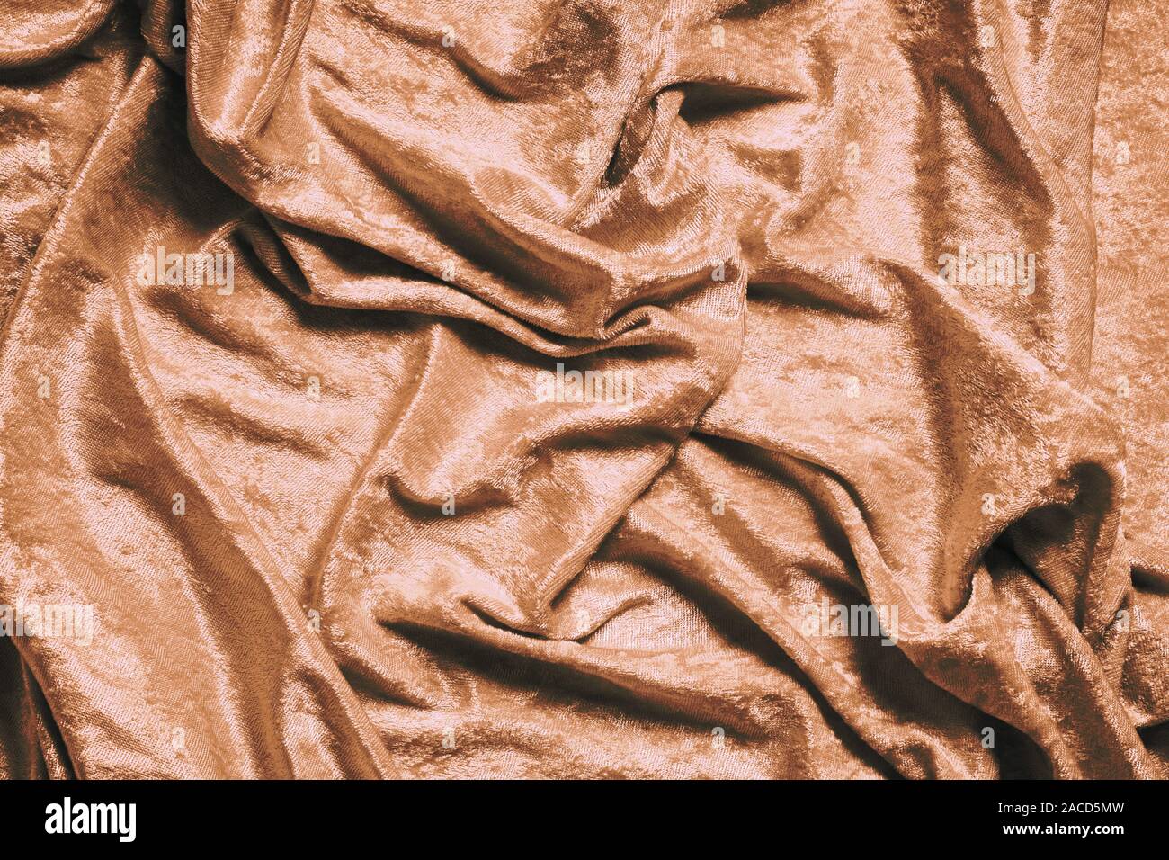 gold or copper colored luxury panne velvet drape background texture ...