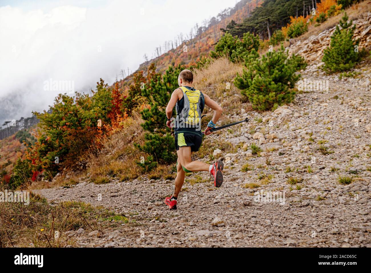 Man running backpack trail hi-res stock photography and images - Alamy