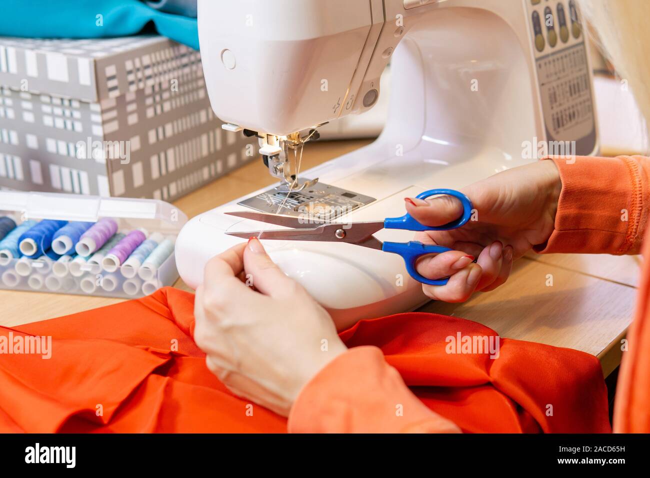 Closeup woman threading needle hi-res stock photography and images - Alamy