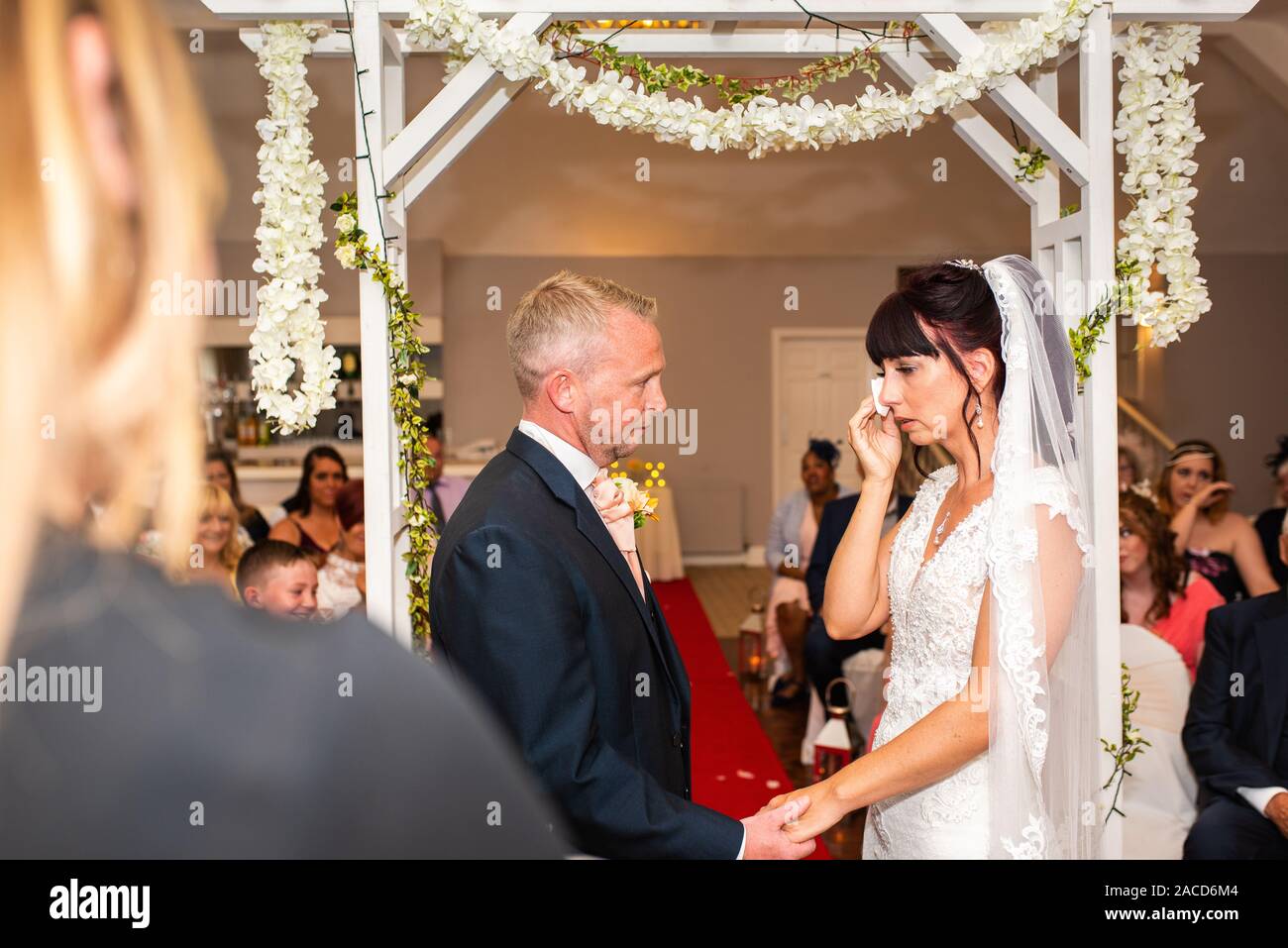 Bride crying during ceremony hi-res stock photography and images - Alamy