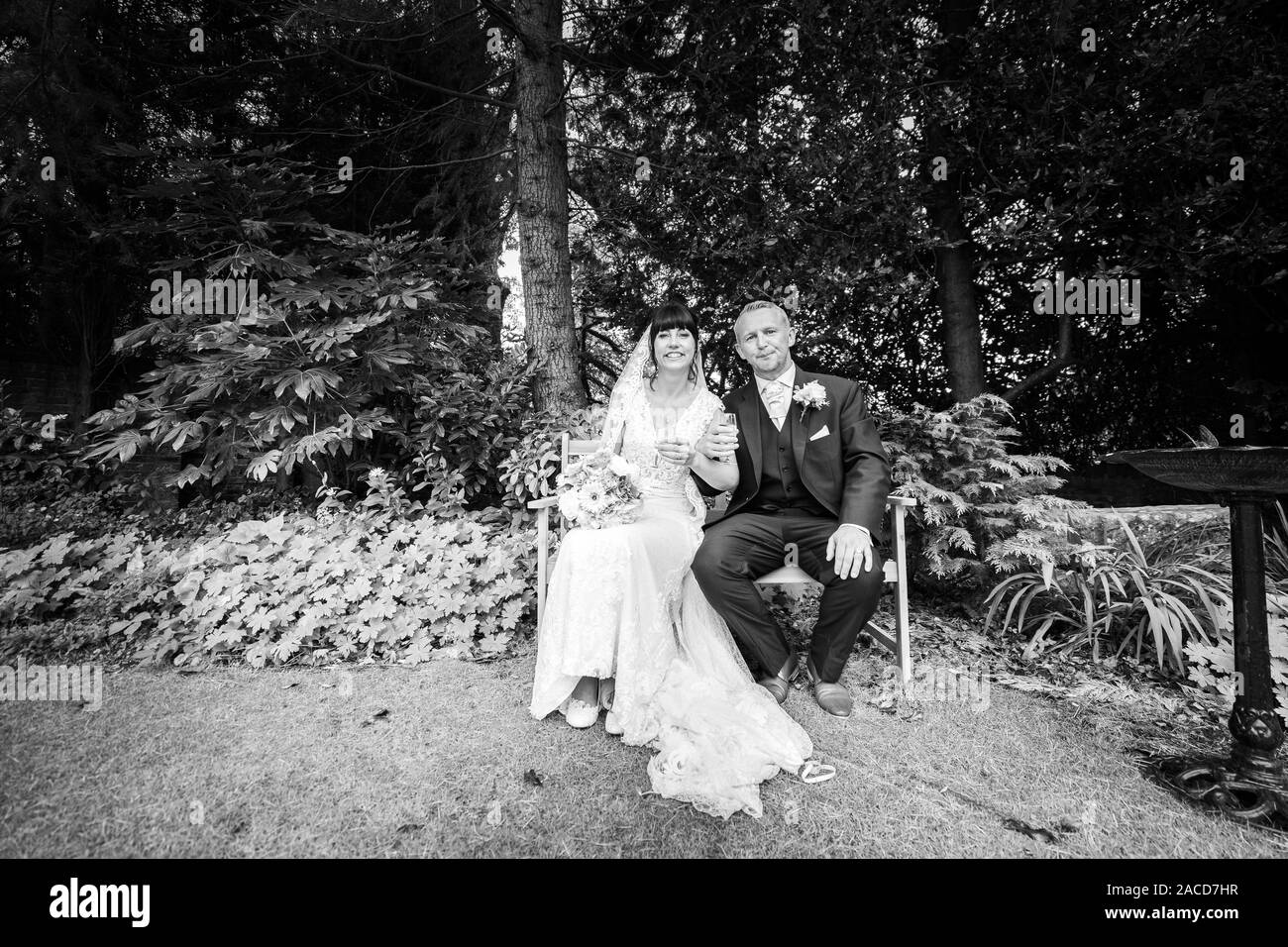 Bride and Groom pose for their after ceremony pictures in the gardens ...