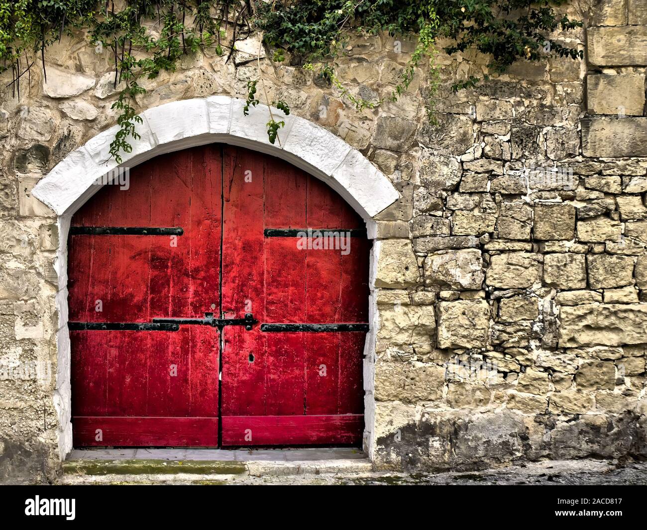 Red medieval door rich in texture Stock Photo - Alamy