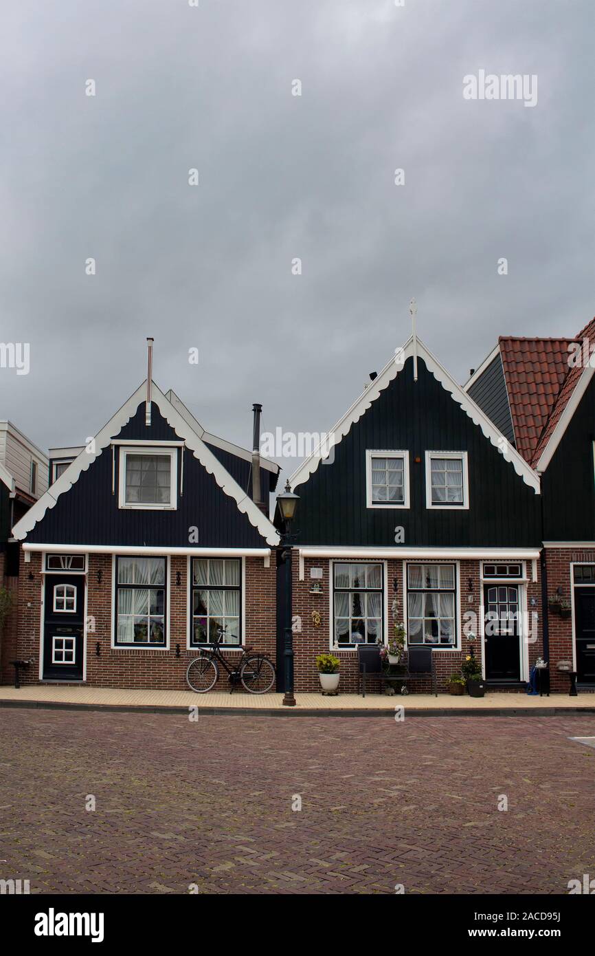 View of historical and traditional houses, plants, bicycle and flowers ...