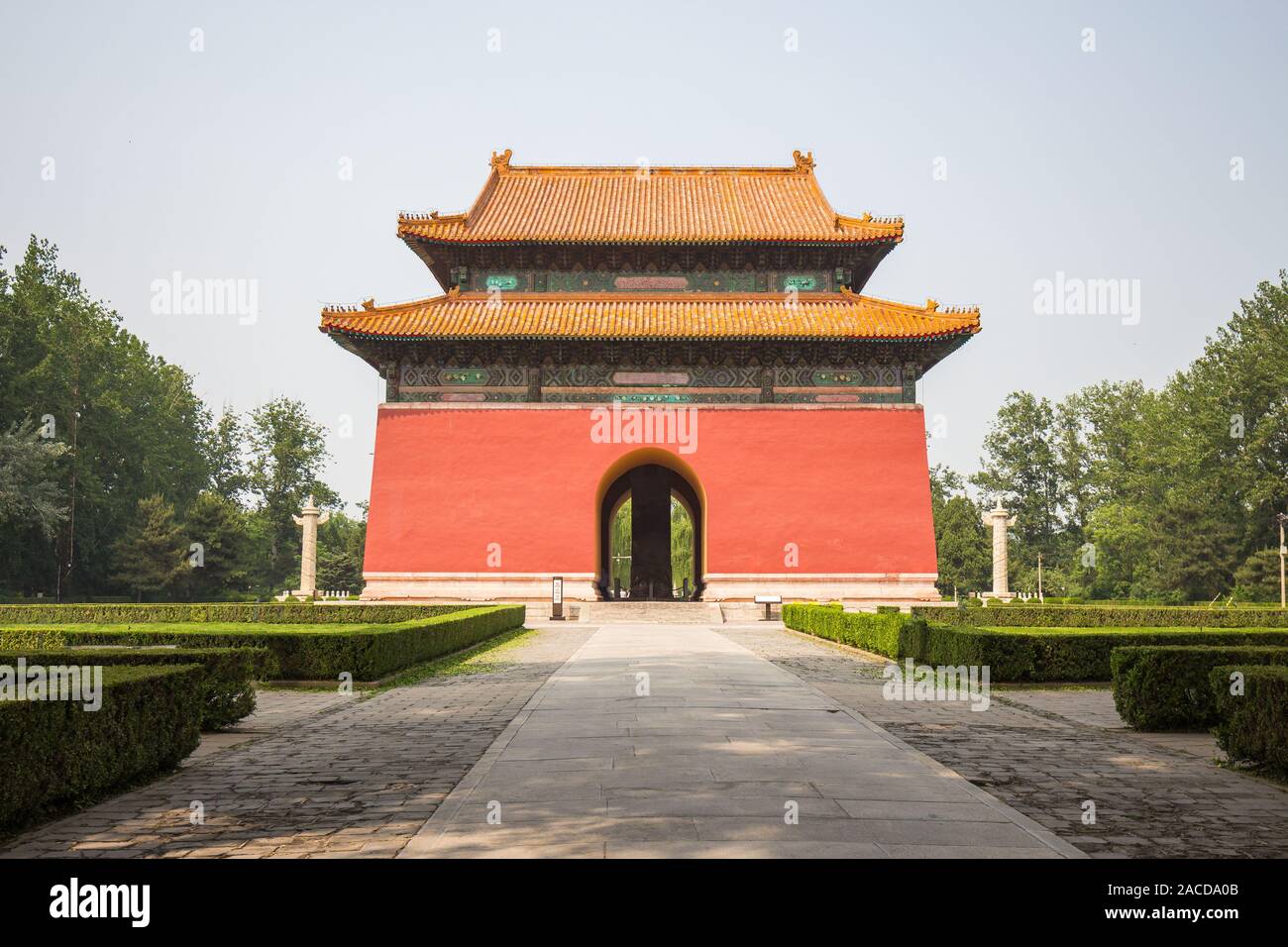 The road in the park leading to the red Chinese house with an arch ...
