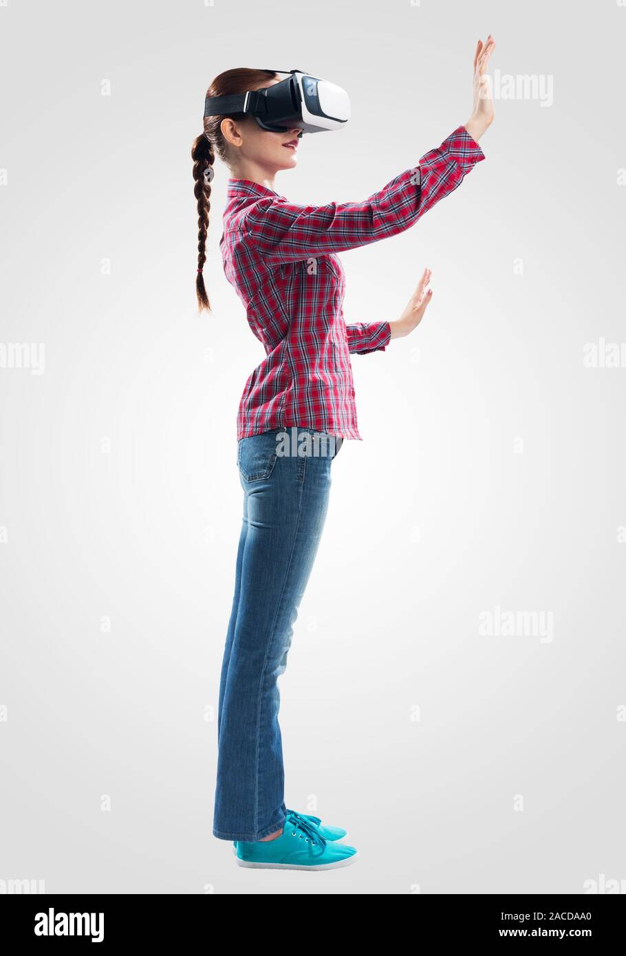 Young woman exploring virtual world Stock Photo - Alamy