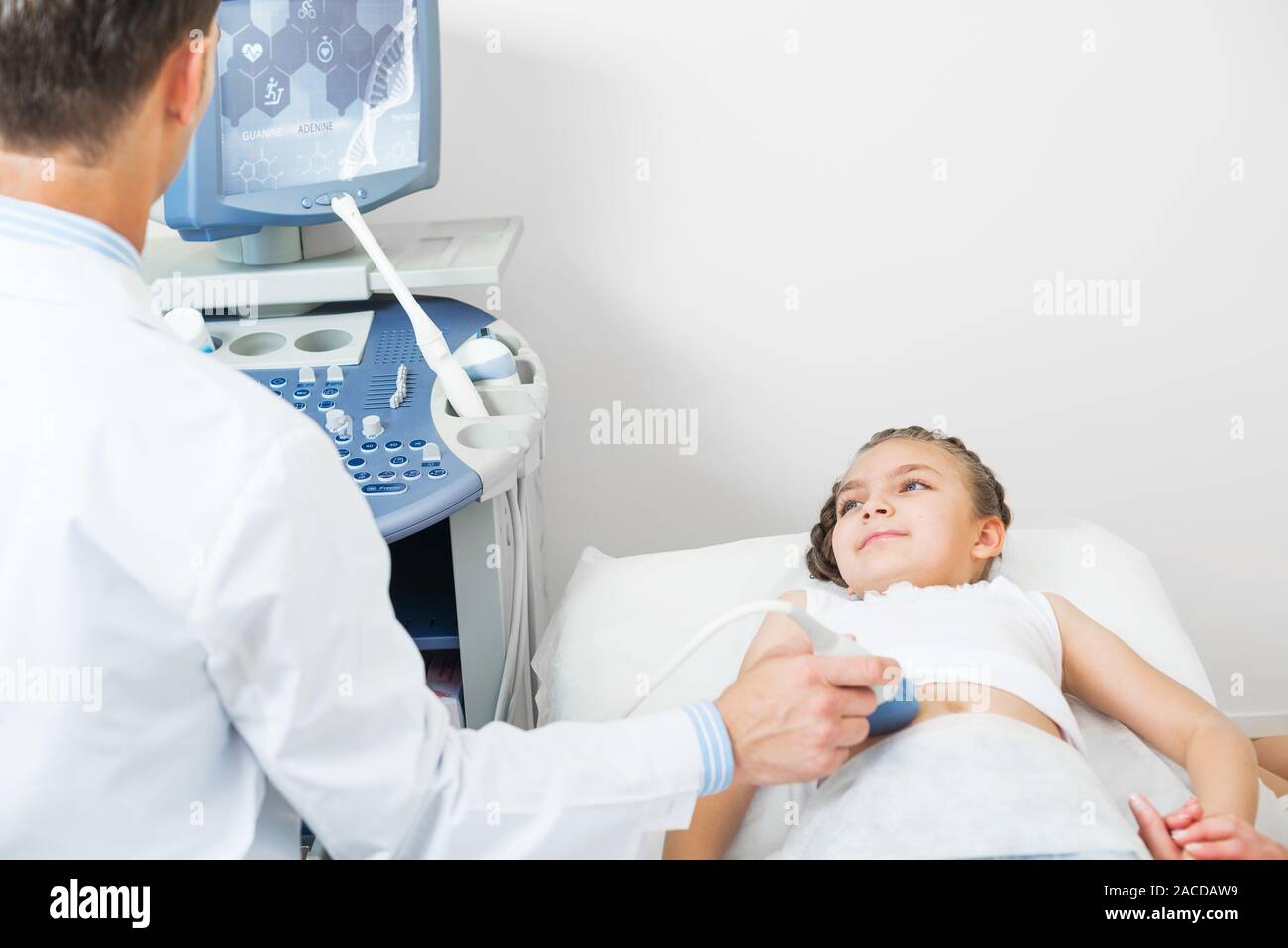 Medical examination of smiling little girl Stock Photo - Alamy