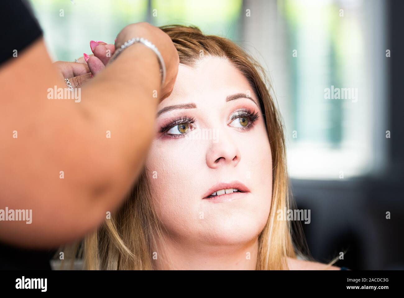 Female getting hair done in salon hi-res stock photography and images ...