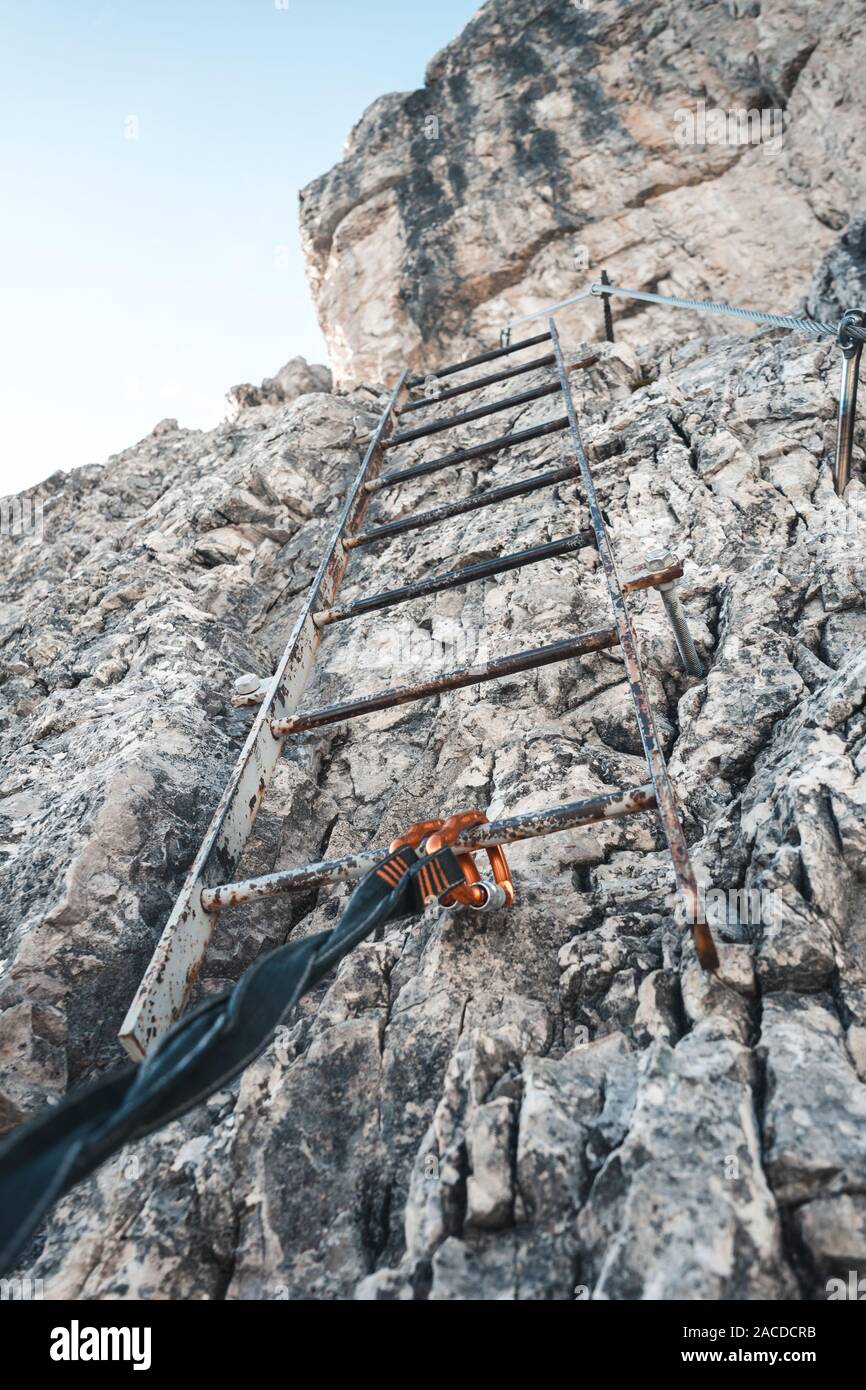 Close up of a via ferrata climbing gear and a letter in the Dolomites ...