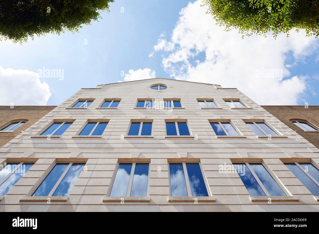 Portland stone facade from below. Devon House, London, United Kingdom ...