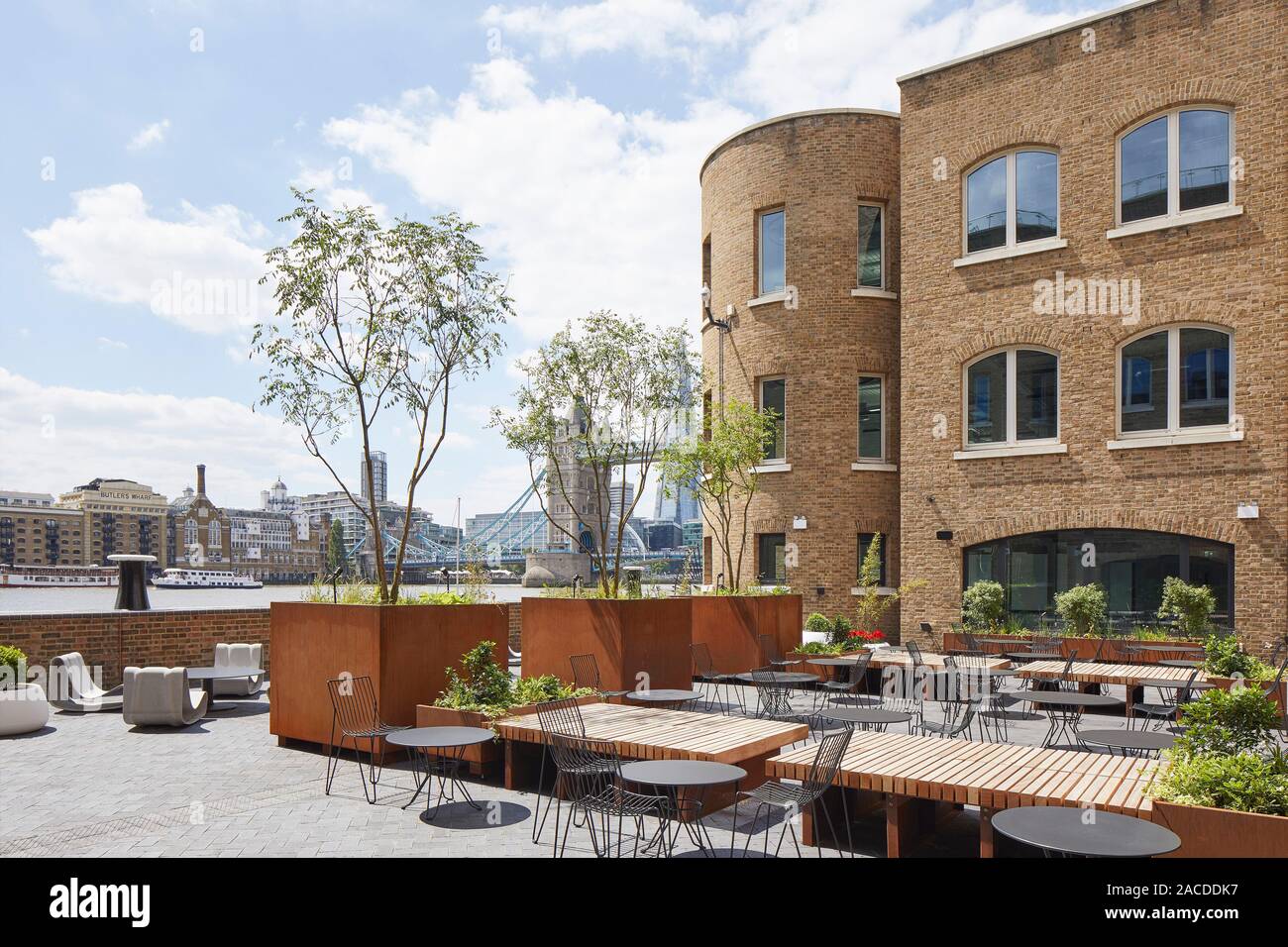View of waterfront terrace with Tower Bridge and Thames. Devon House ...