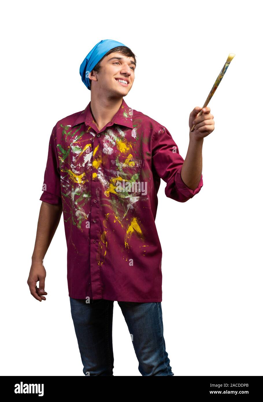Young male artist holding paintbrush Stock Photo - Alamy