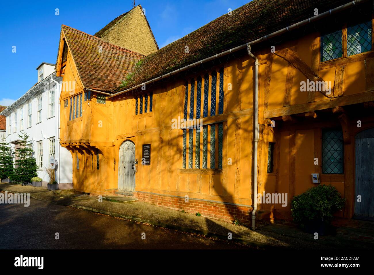 The orange painted Little Hall, which is a late 14th Century timber ...