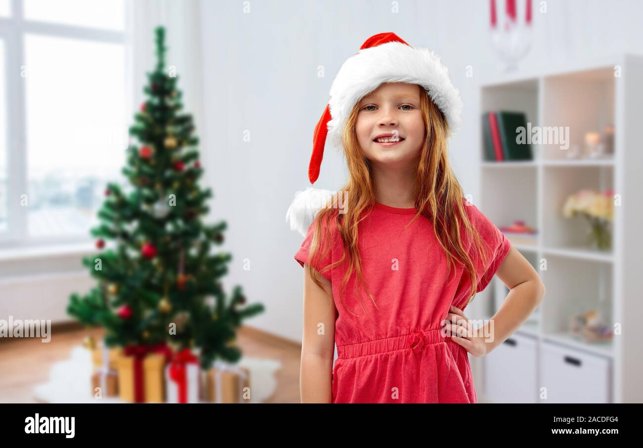 Pretty redhead in santa hat hi-res stock photography and images - Alamy