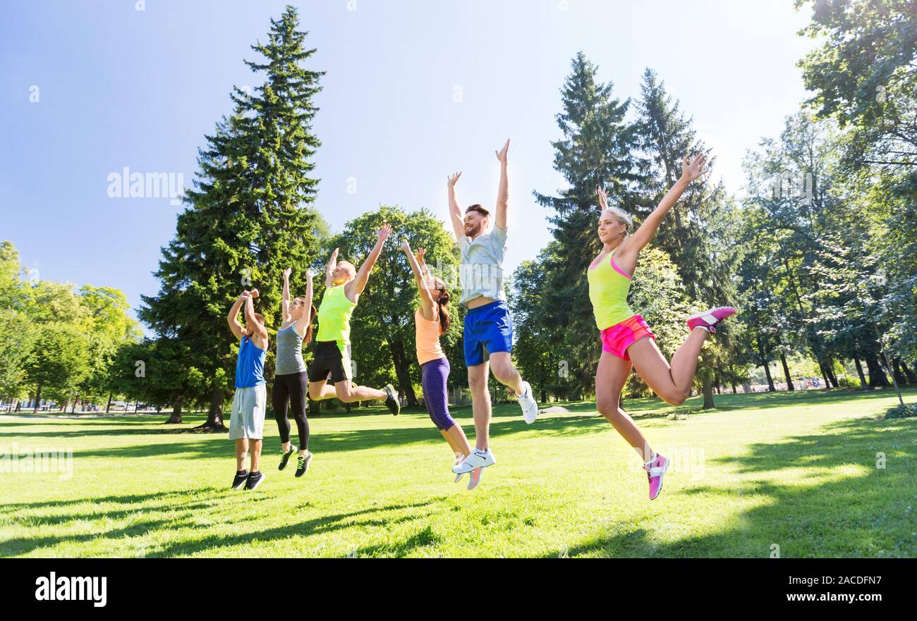 Young adult friends jumping hi-res stock photography and images - Alamy