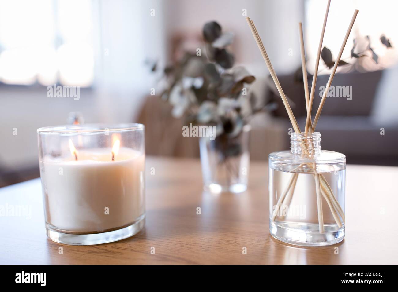 aroma reed diffuser, burning candle and perfume Stock Photo - Alamy