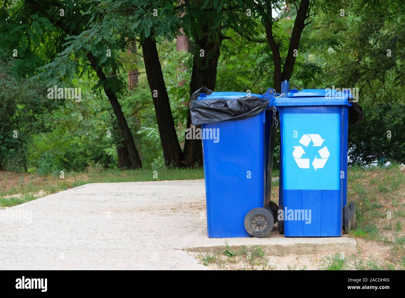 Waste recycling concept. Blue containers for further processing of ...