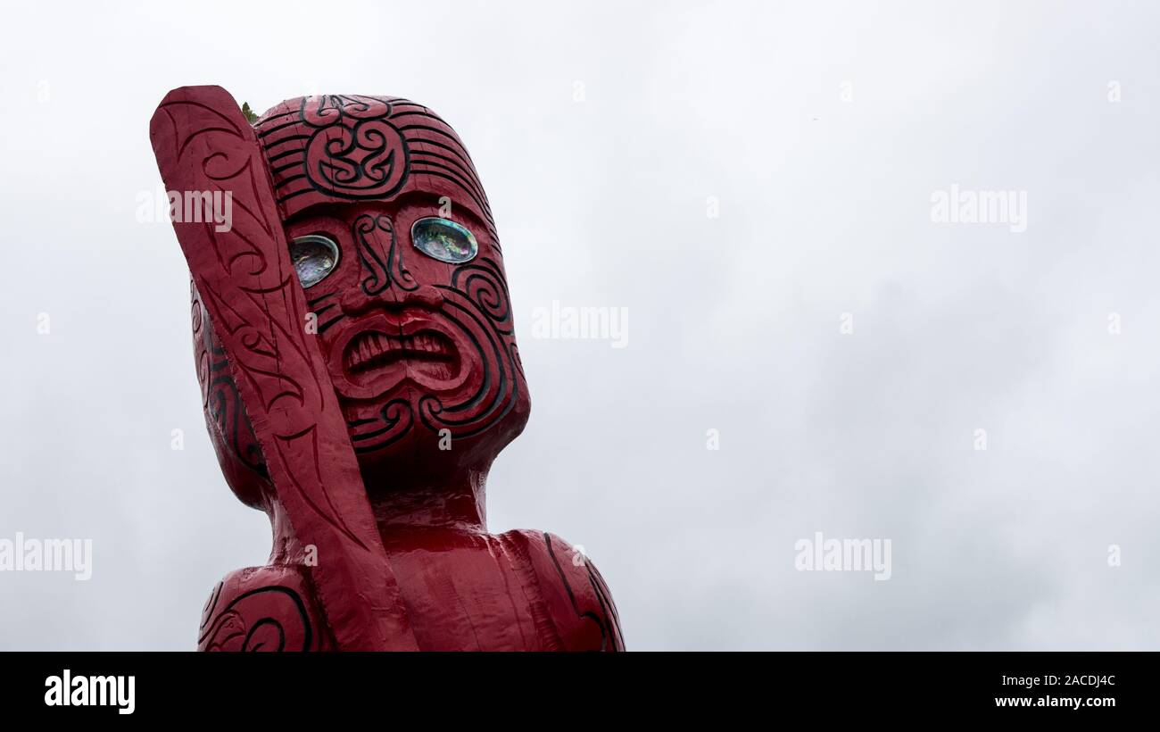 Red Maori statue in New Zealand Stock Photo - Alamy