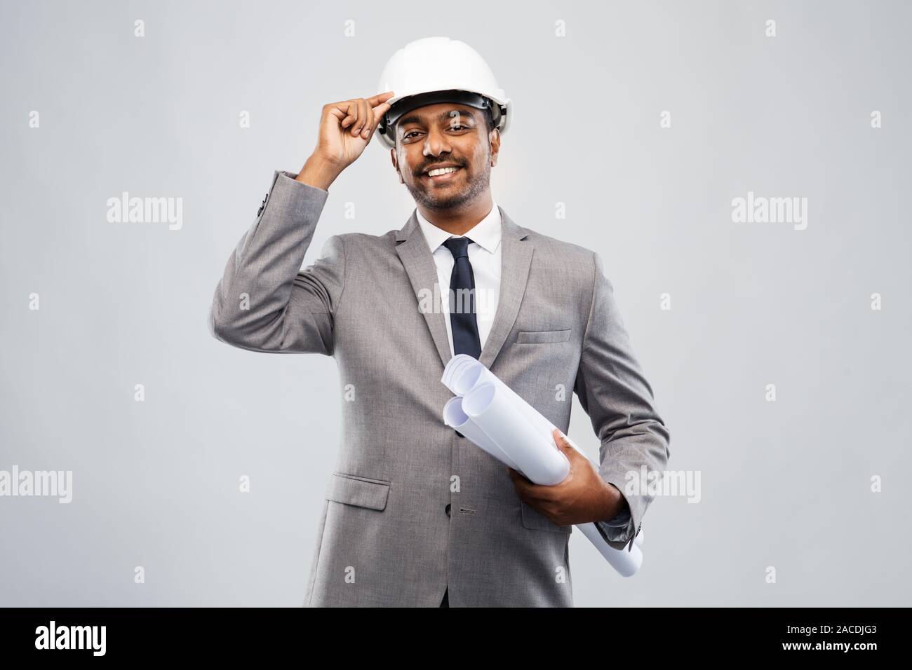 indian male architect in helmet with blueprints Stock Photo - Alamy