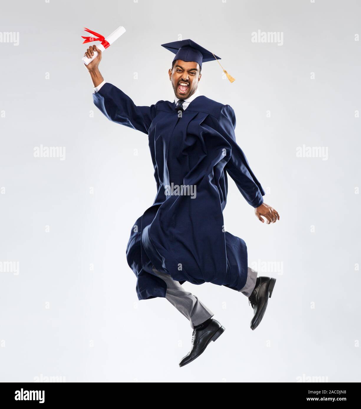 happy jumping indian graduate student with diploma Stock Photo - Alamy