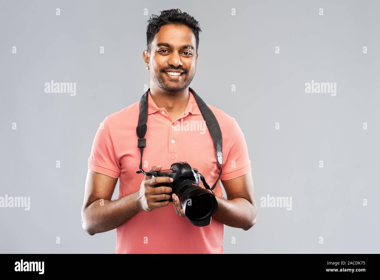 indian man or photographer with digital camera Stock Photo - Alamy
