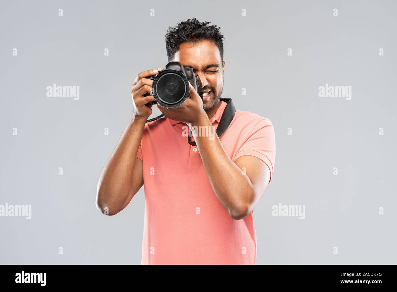 indian man or photographer with digital camera Stock Photo - Alamy