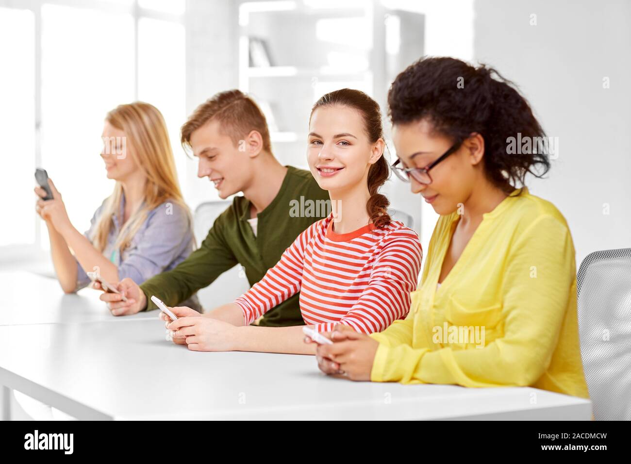 happy high school students with smartphones Stock Photo - Alamy