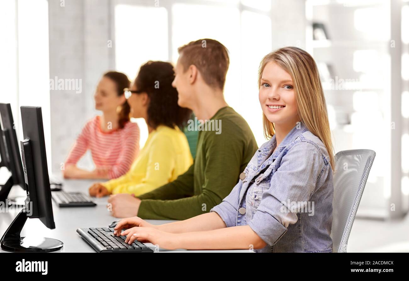 happy high school students in computer class Stock Photo - Alamy