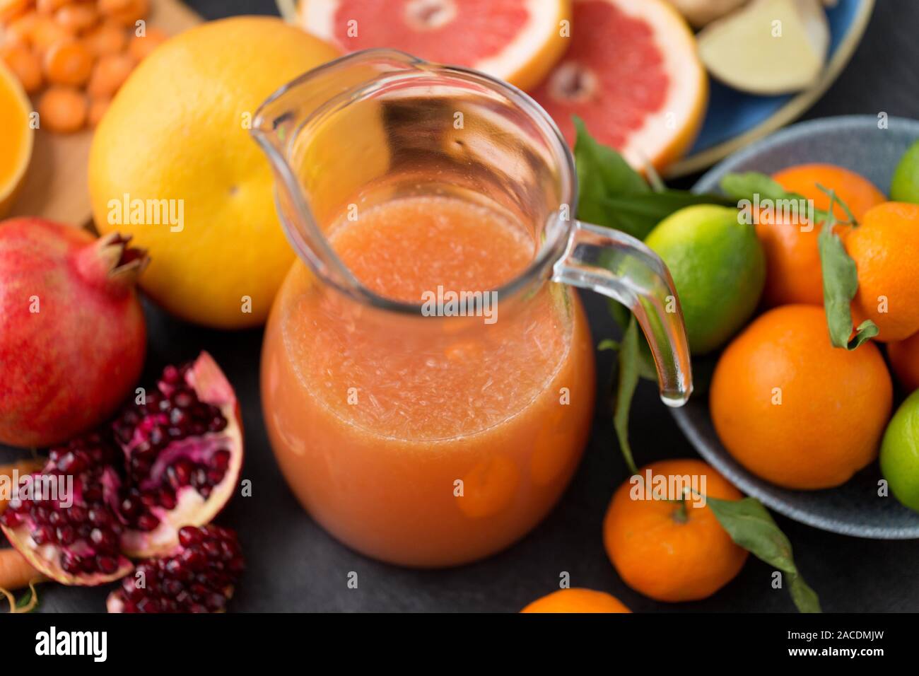 glass jug of juice with fruits and vegetables Stock Photo - Alamy