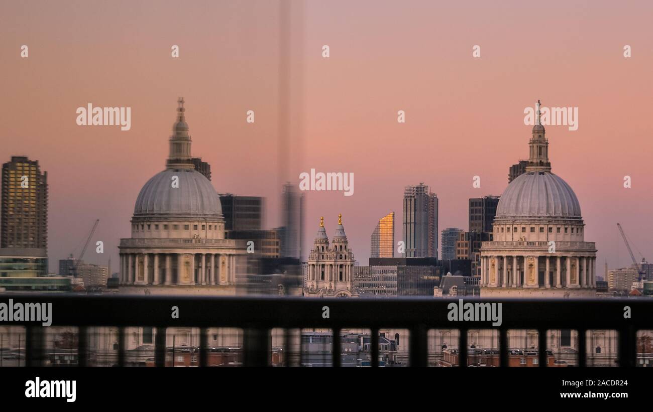 London, UK, 2nd Dec 2019. The dome of St Paul's Cathedral is reflected ...