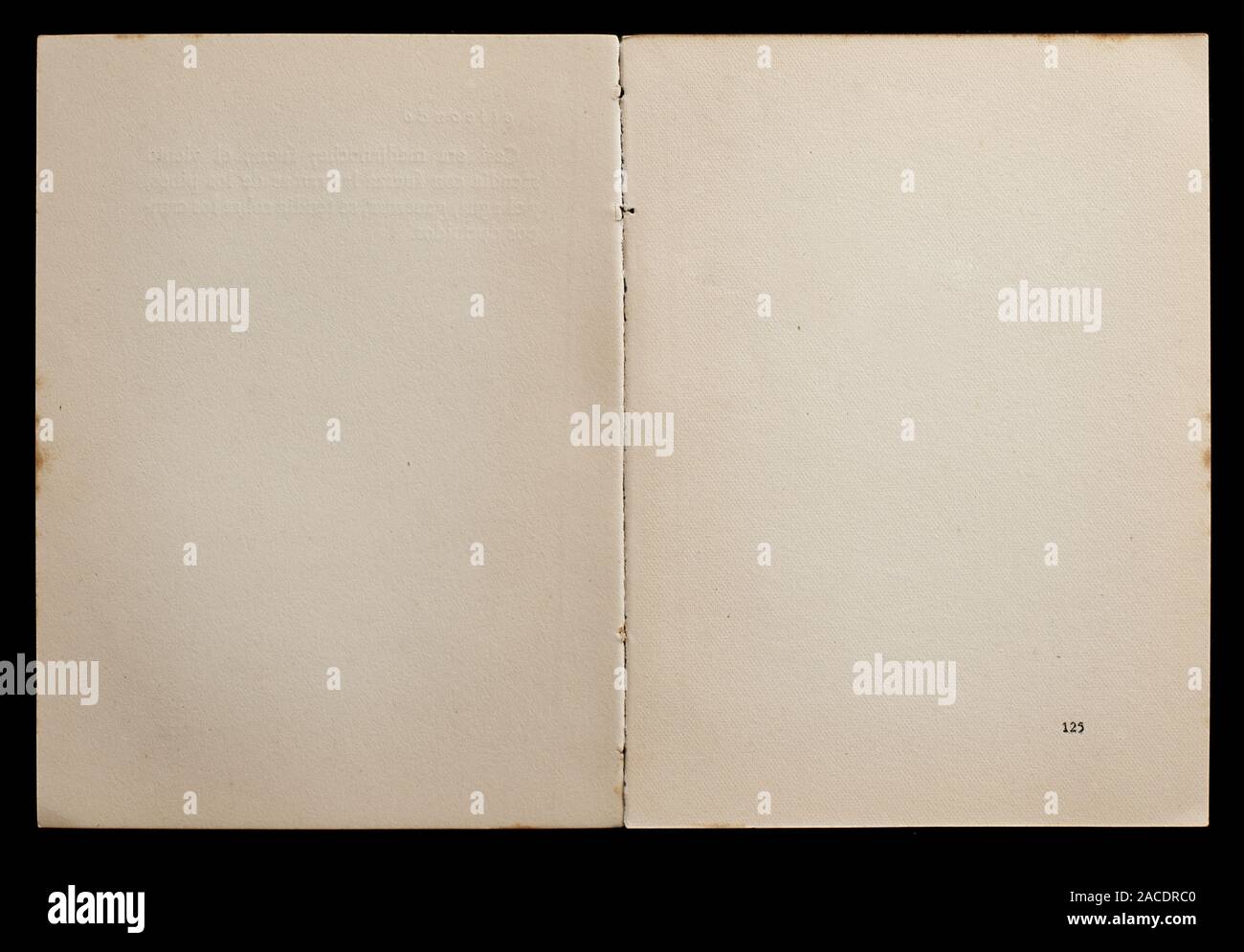 Antique book unfolded showing textured pages isolated on black ...